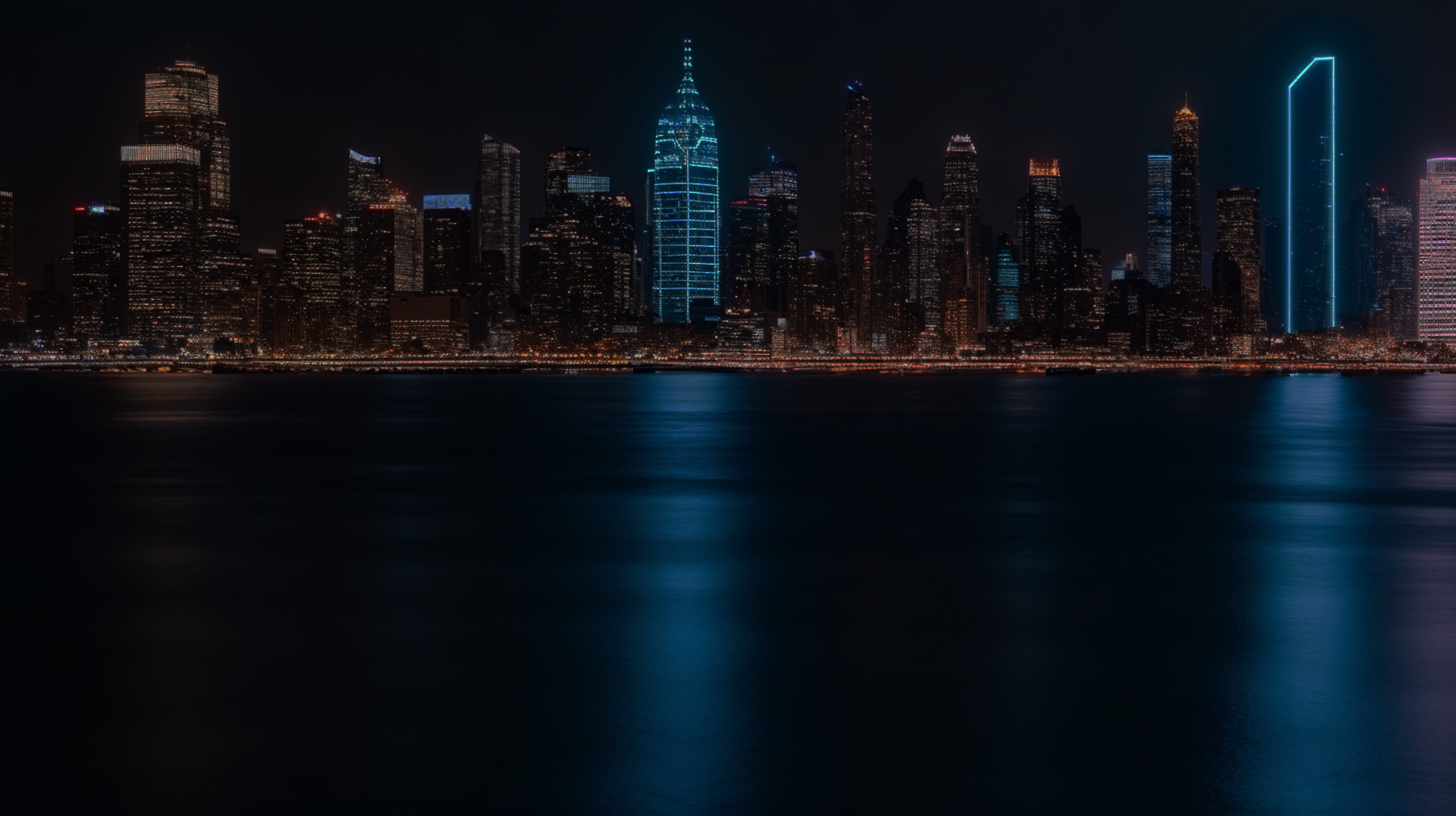 A futuristic city skyline illuminated at night, featuring tall, modern skyscrapers with vibrant neon lights, reflected on the calm surface of the water in the foreground.